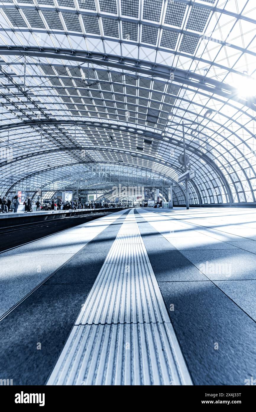 View along the railway tracks under an impressive glass dome in ...