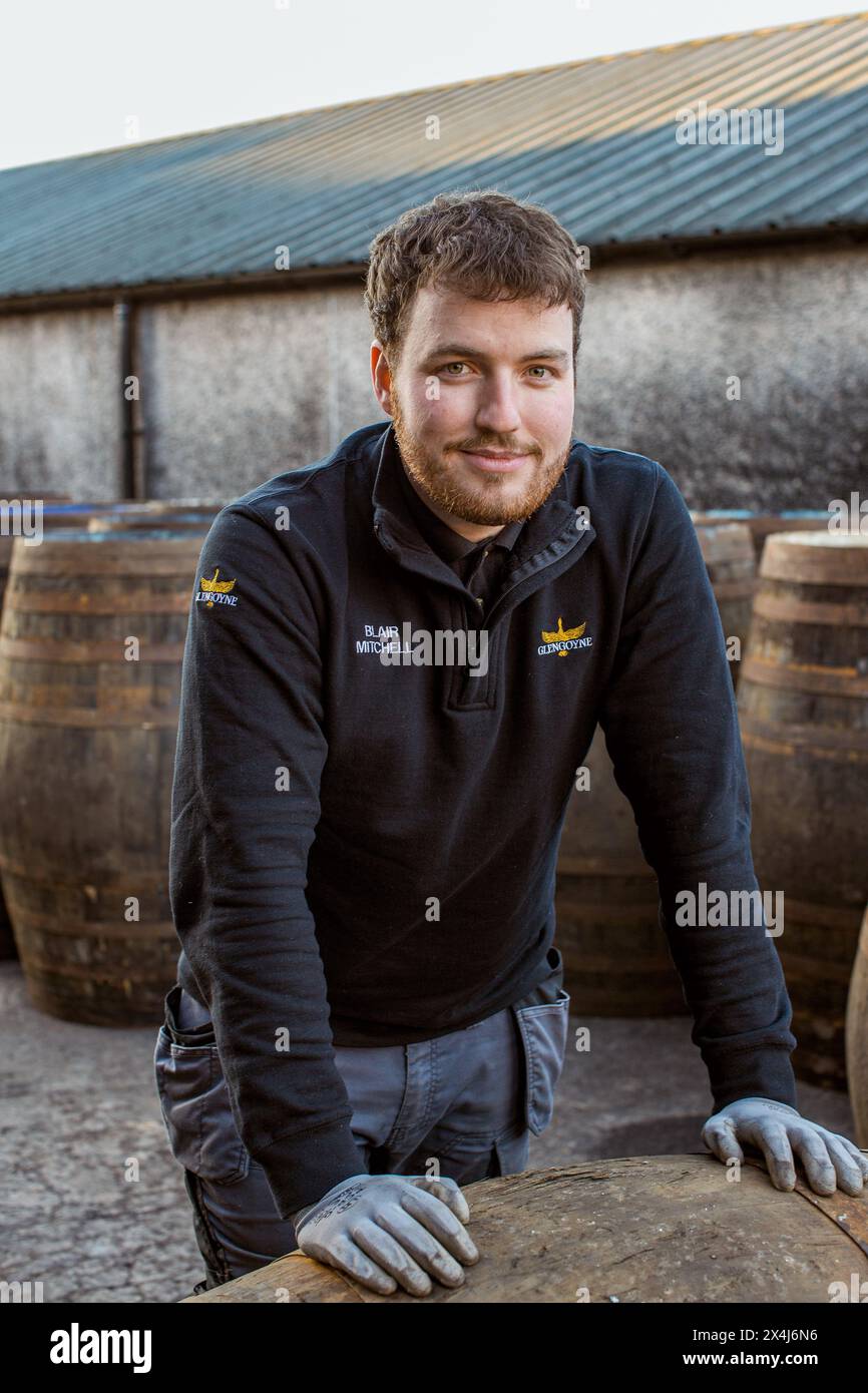 warehouse man, rolling a whisky cask at the Glengoyne Distillery ...