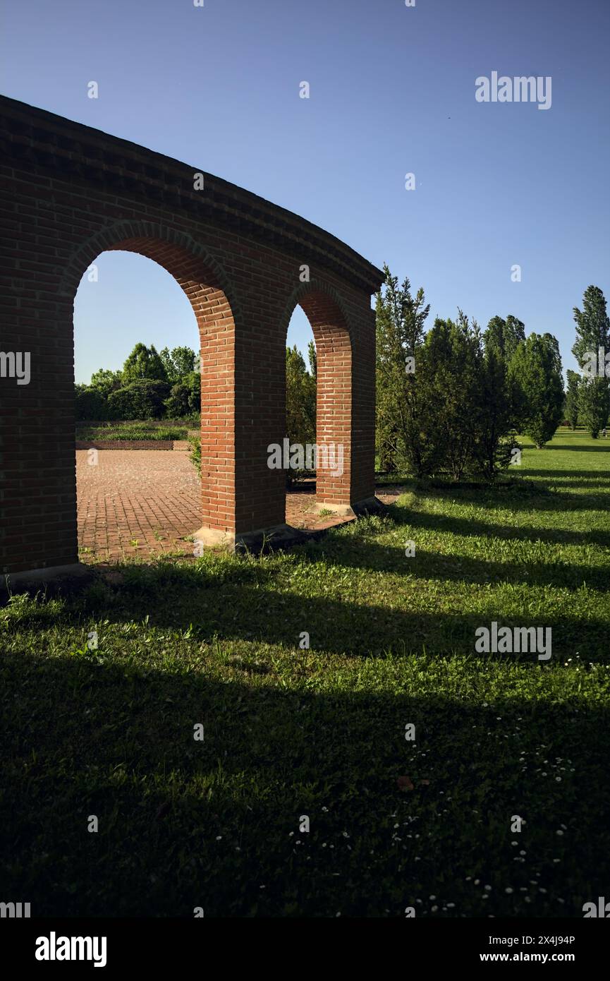 Structure resembling an amphitheatre in a park at sunset Stock Photo ...