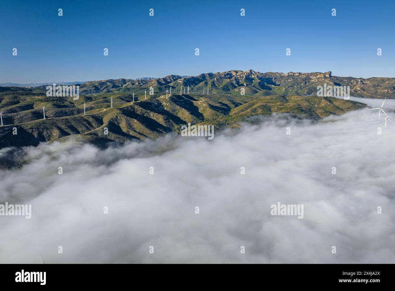 Aerial view of the Cardó - Boix mountain range on a winter morning with ...