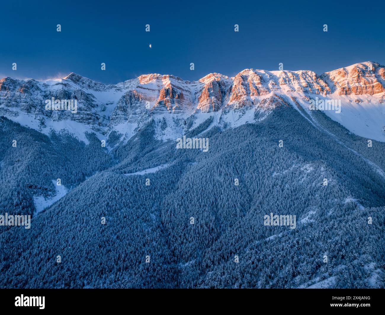 Aerial view of the Serra del Cadí on a winter sunrise after a snowfall ...
