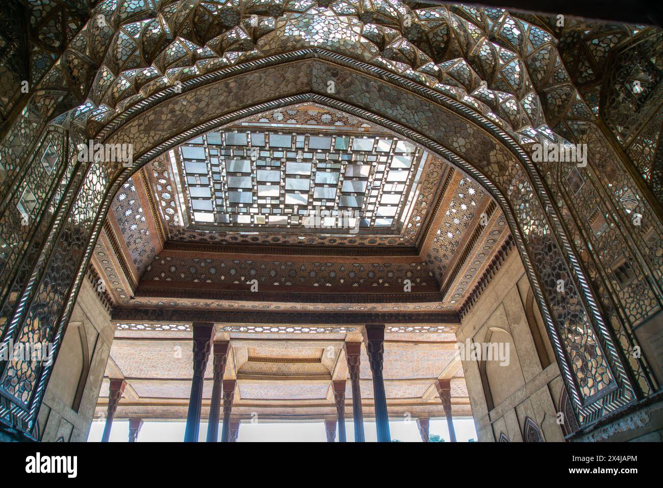 Intricate Persian architecture inside Chehel Sotun Palace. Reflective ...