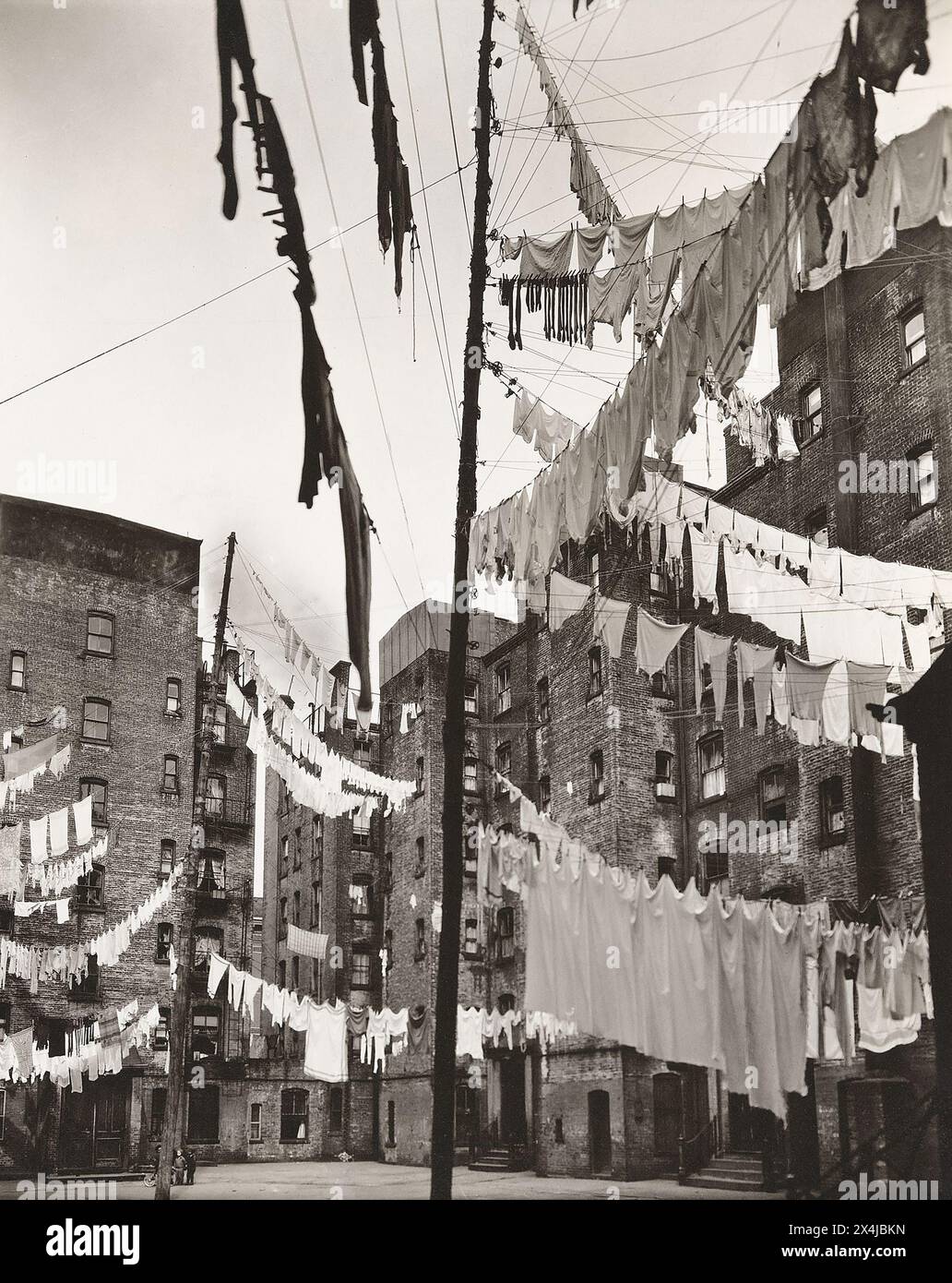 Courtyard of tenement buildings filled with lines of laundry, Yorkville ...