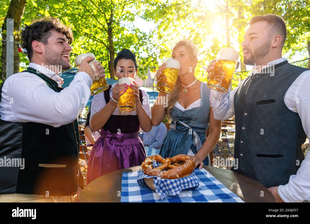 Octoberfest friends in traditional attire hi-res stock photography and ...
