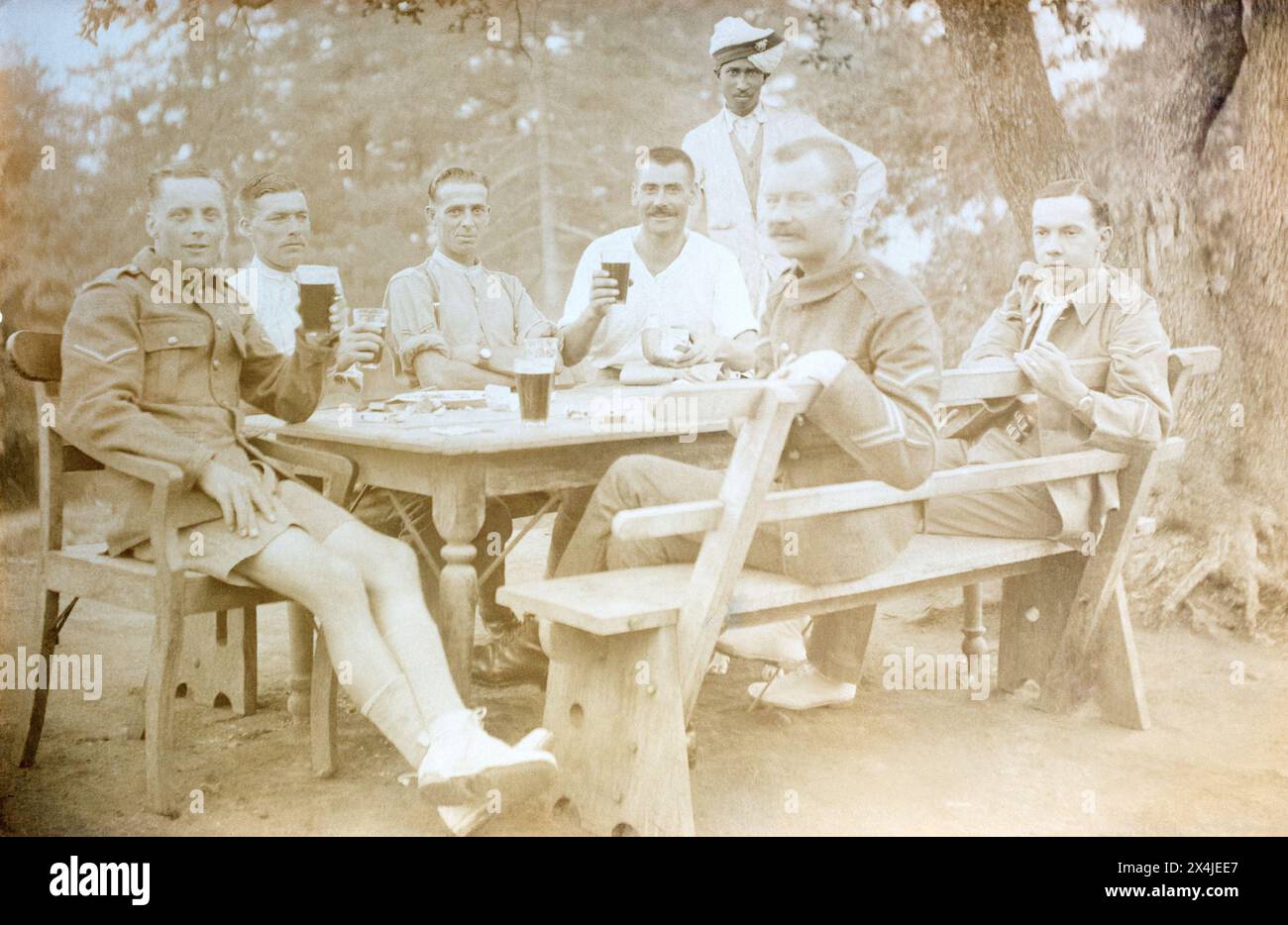 Men of the Royal Sussex Regiment drinking beer, with a regimental ...