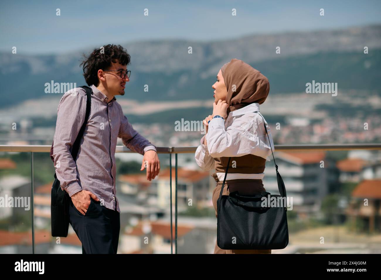After a day at the office, a business man engages in conversation with ...