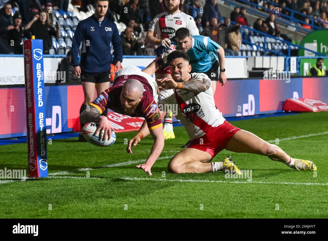 Jake Bibby of Huddersfield Giants goes over for a try during the ...