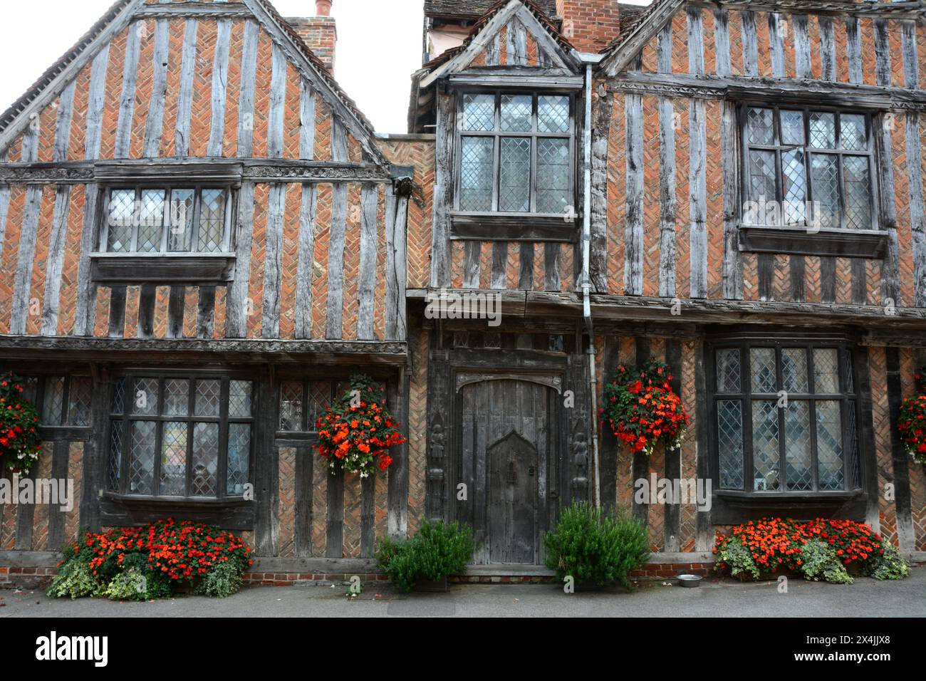 Old medieval half-timbered "crooked houses" in the village of Lavenham in Suffolk county ...