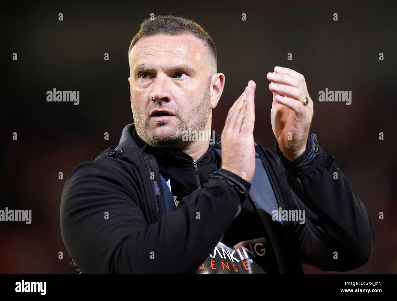 Bolton Wanderers manager Ian Evatt applauds the fans following the Sky ...