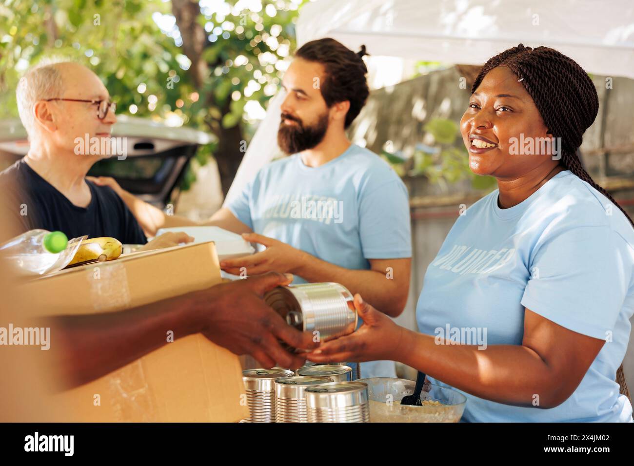 Man giving donation boxes hi-res stock photography and images - Alamy