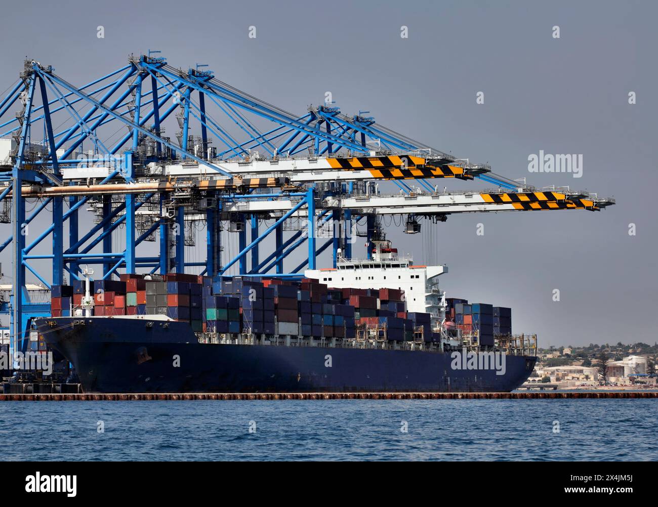 Malta Island, Marsaxlokk, cargo ships loading factory Stock Photo - Alamy