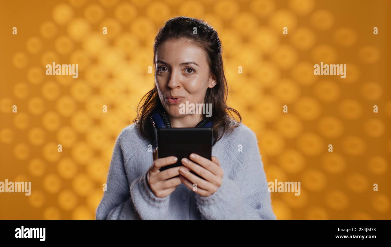 Voice actor reading ebook in entertaining manner in front of audience ...