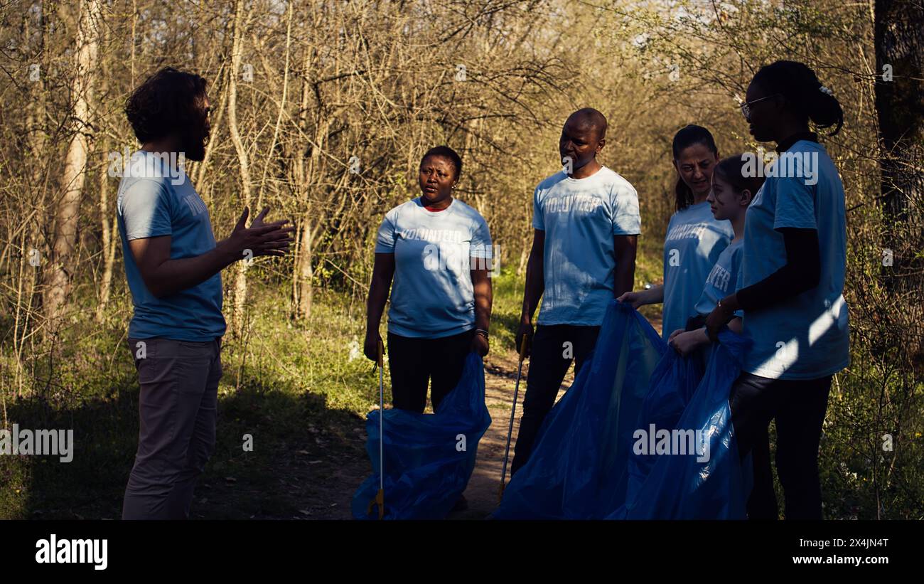 Team of activists picking up plastic waste to recycle and collect ...