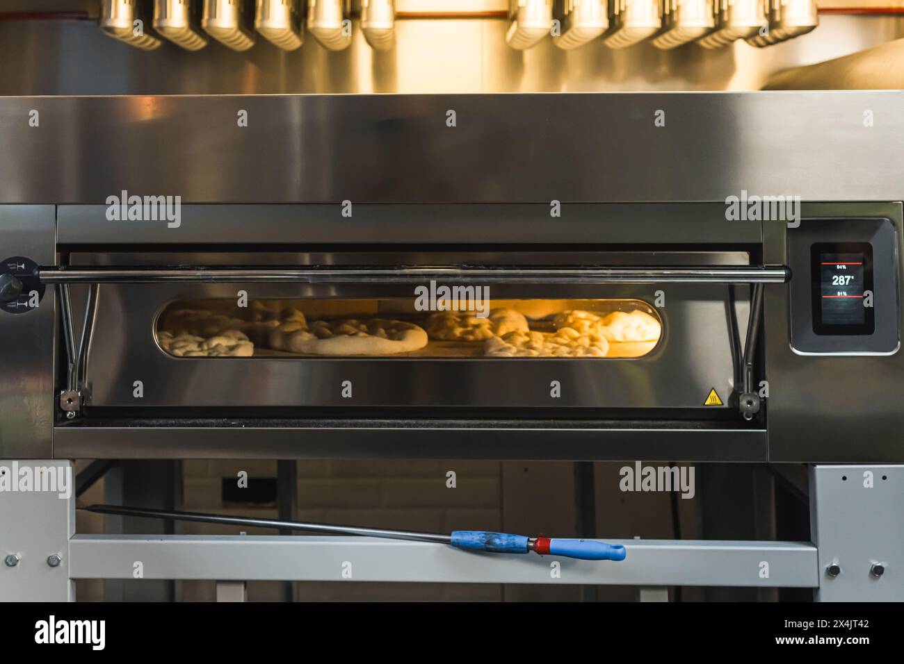 baking pizzas in an oven, bakery kitchen, italian tastes. High quality ...