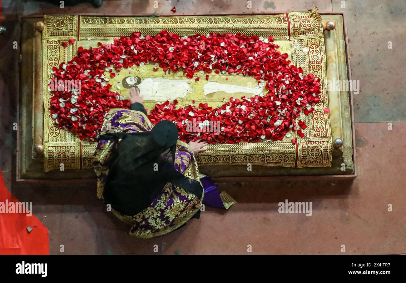Jerusalem, Israel. 3rd May 2024. A bishop arranging the roses flowers ...