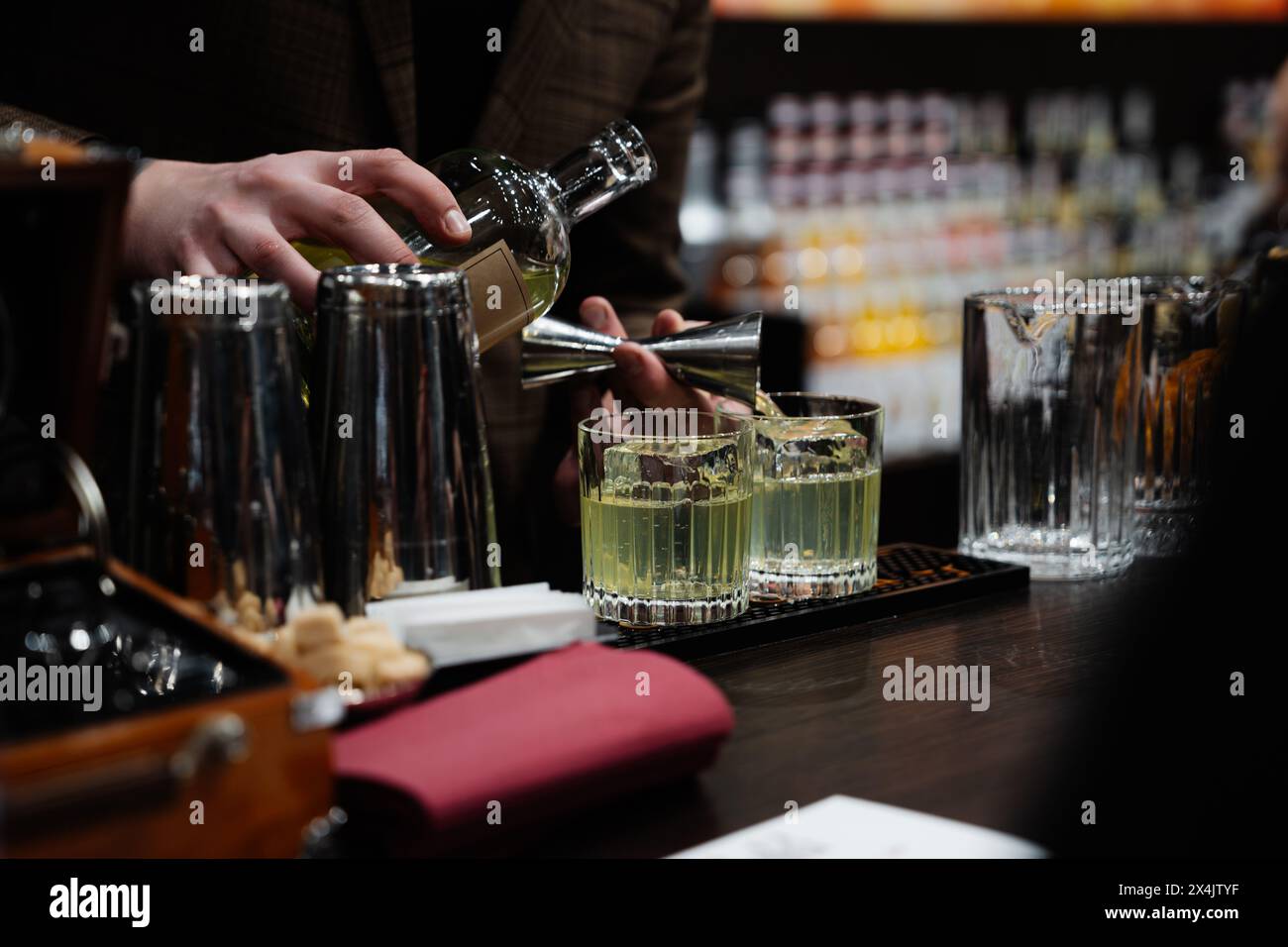 Preparation of green cocktails on an alcoholic basis Stock Photo - Alamy