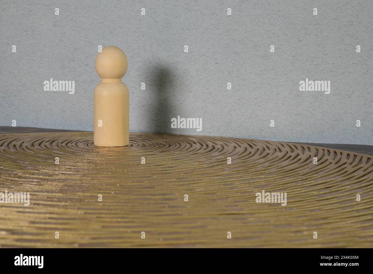 Wooden human figure with question marks. The concept of question or ...