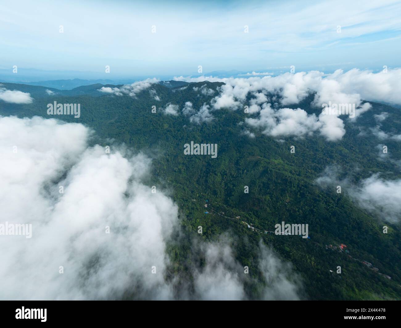 Aerial view flowing fog waves on mountains tropical rainforest,Bird eye ...