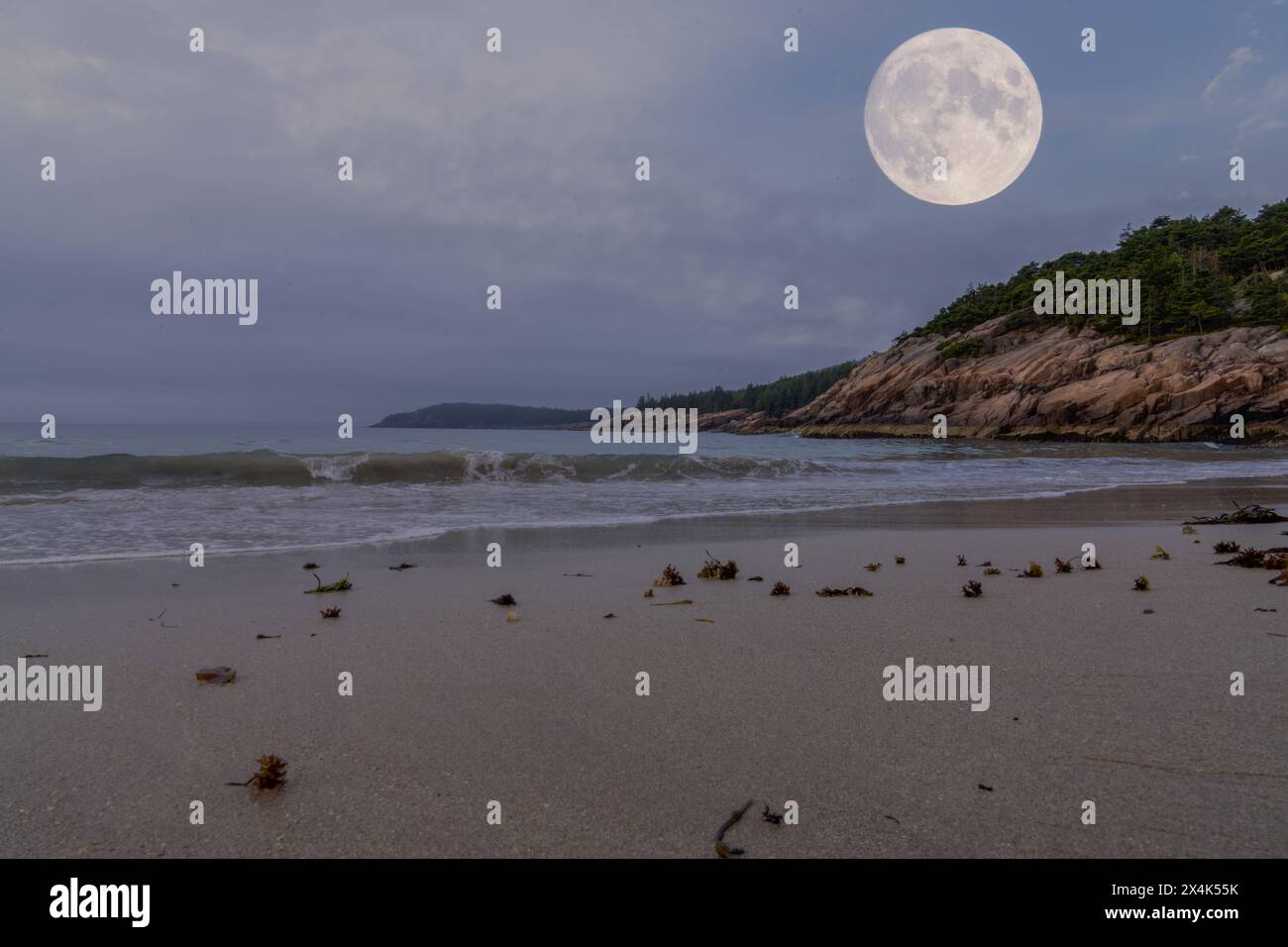 Giant moon over the beach Stock Photo - Alamy