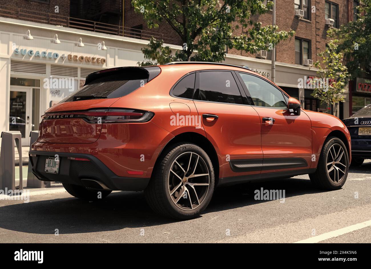 New York City, USA - August 05, 2023: 2023 Porsche Macan T SUV Ruby red ...