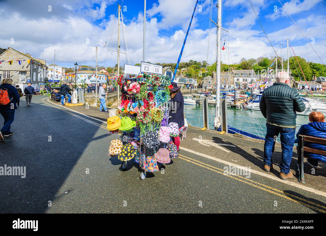 Garlands and hats for sale by the harbour for the 'Obby 'Oss festival ...