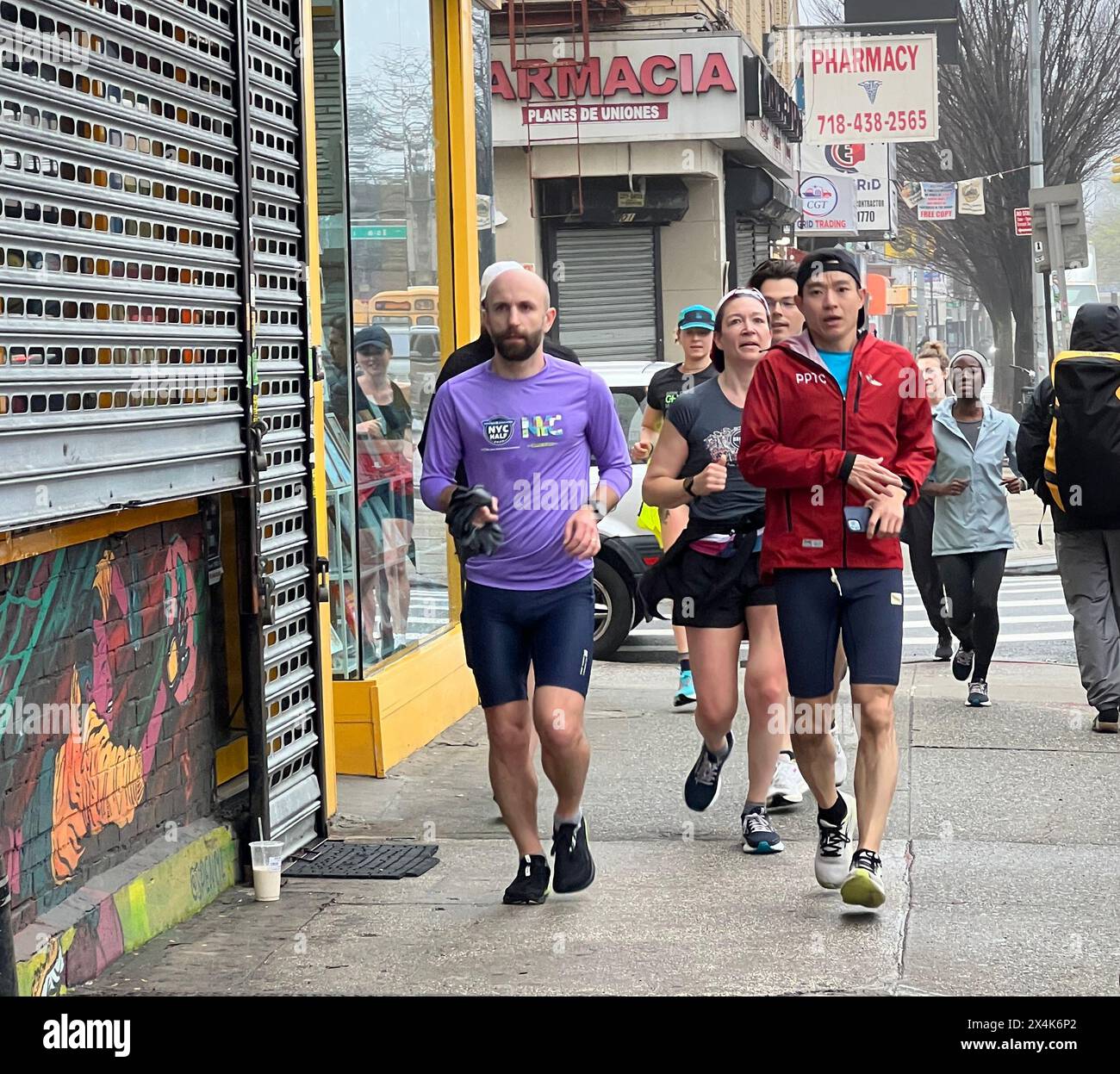 Running group coming into a landing Stock Photo - Alamy
