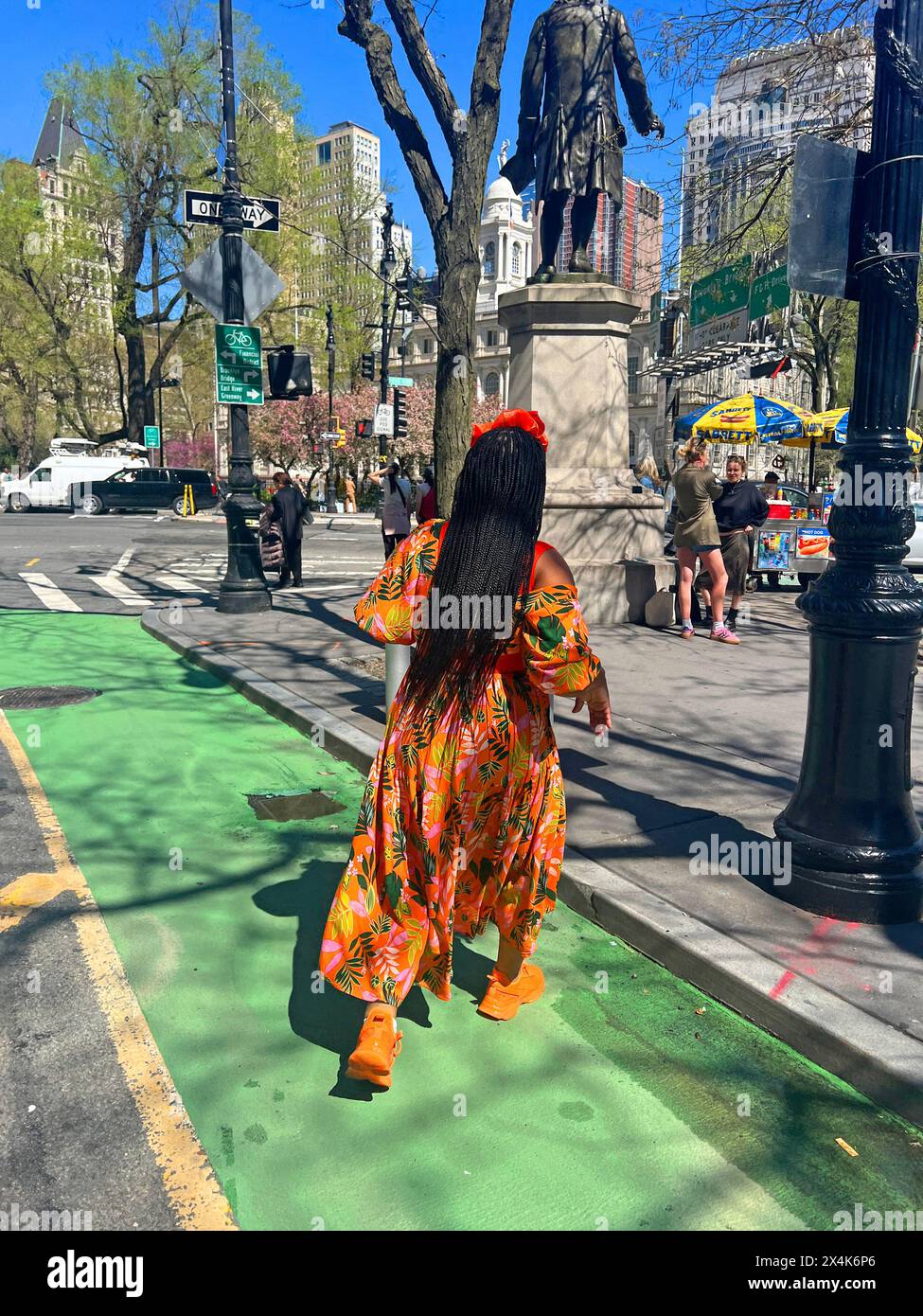 Caribbean style woman crosses the street in Manhattan, New York City ...