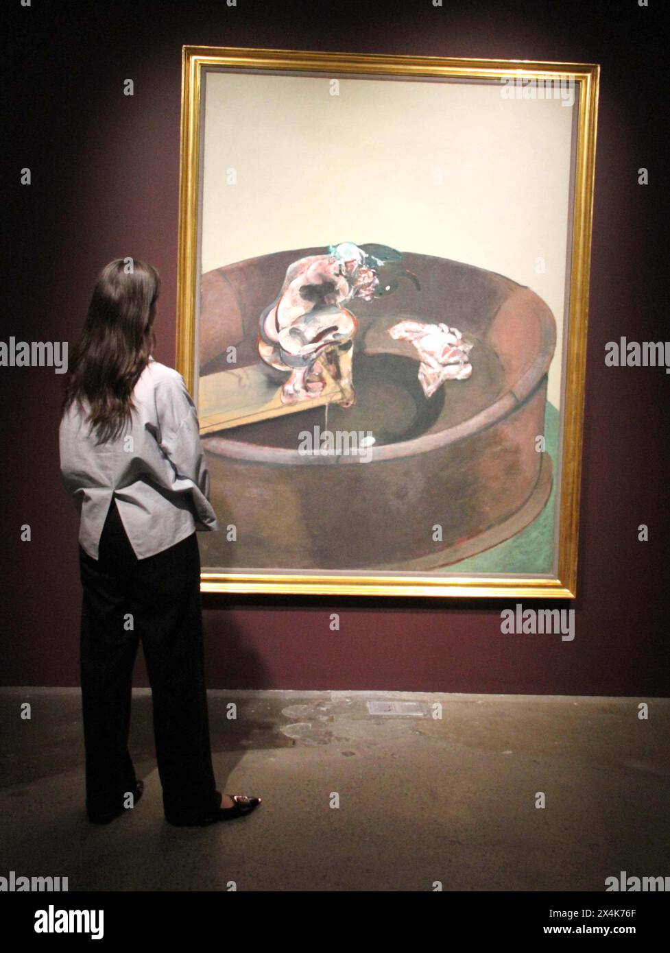 New York, New York, USA. 3rd May, 2024. A woman views artist Frances Bacon's Portrait of George ...