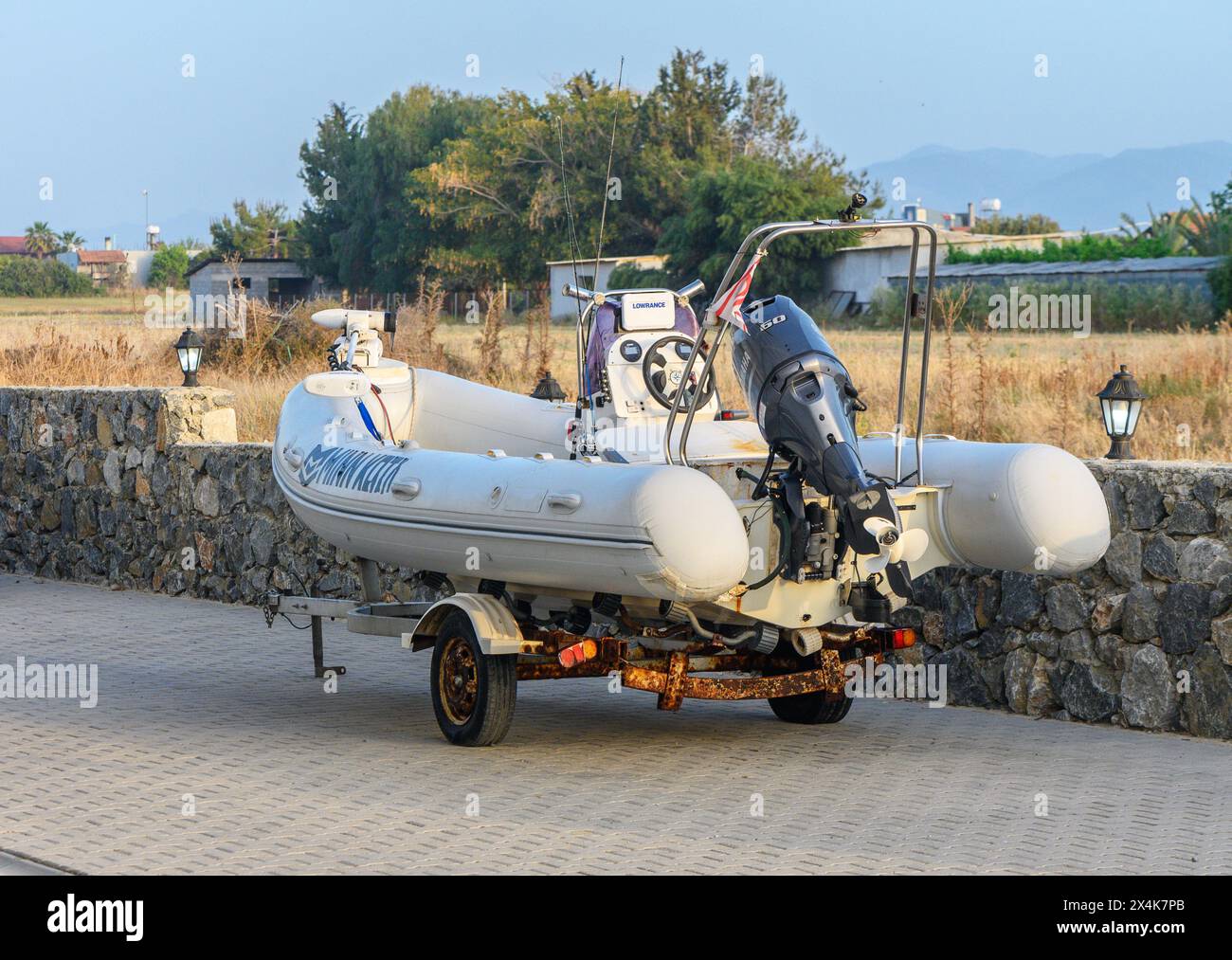 Gaziveren Cyprus - 04.24.2024 white fishing rubber boat on trailer 3 ...