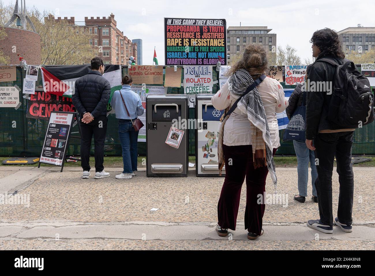 People look at the metal fence now in place to prevent clashes between ...