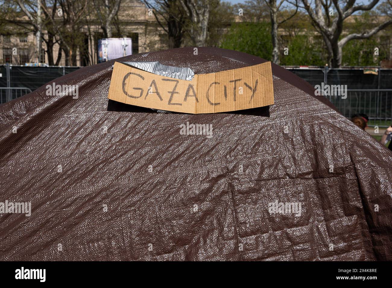 A placard is taped to a tent at the MIT encampment that reads, "Gaza ...