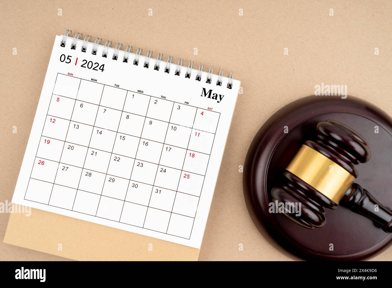 Desk calendar for May 2024 and judge's gavel on brown background Stock ...