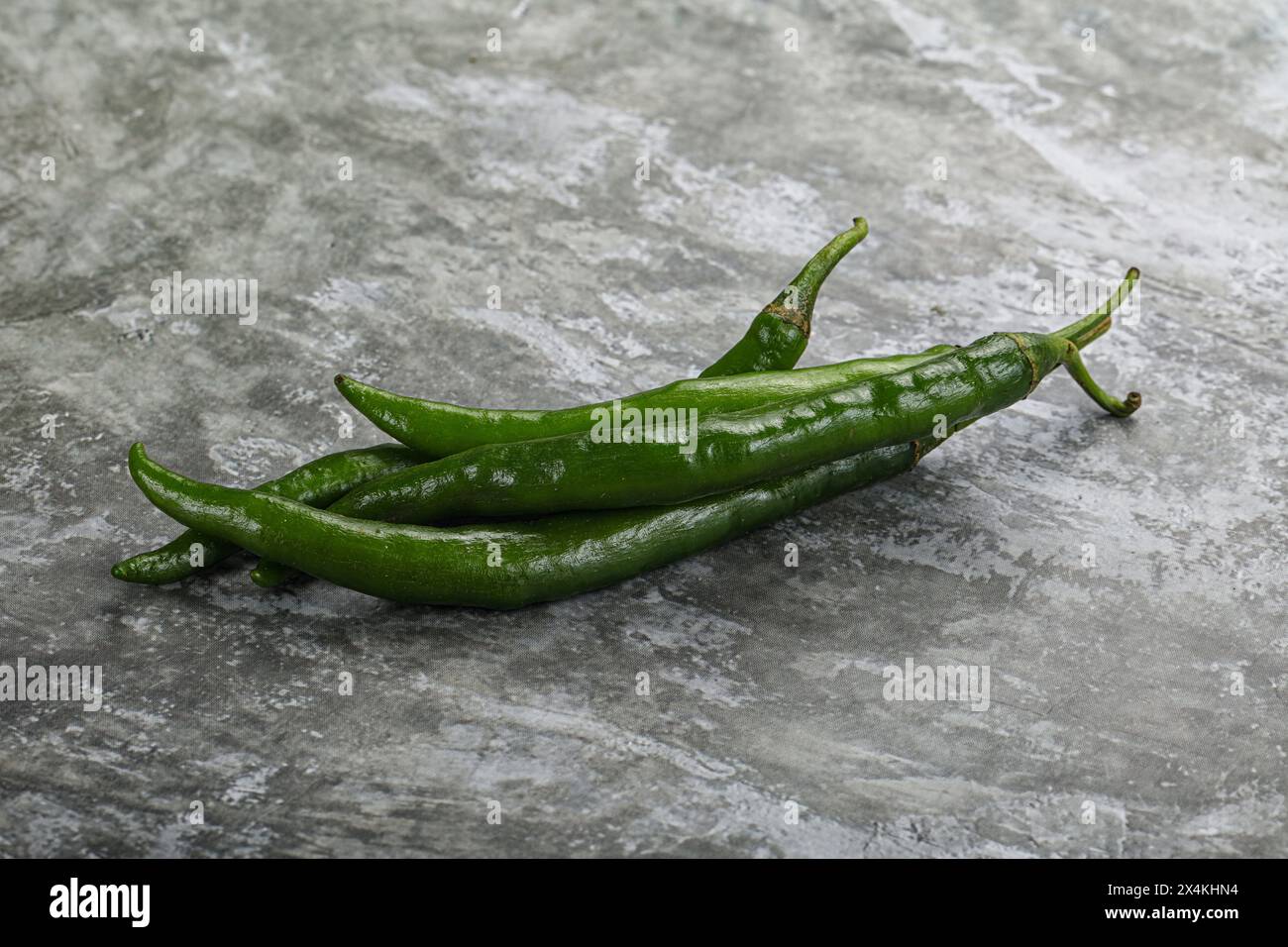 Hot and spicy green chili pepper heap Stock Photo - Alamy
