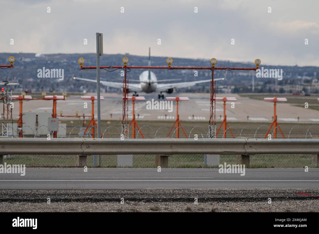 Jet liner landing on airport runway Stock Photo - Alamy