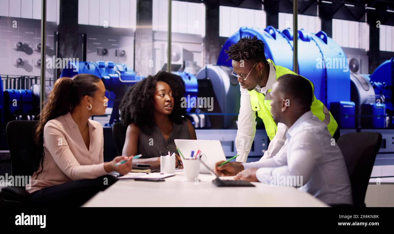 Business People And Workers Team At Power Plant Stock Photo - Alamy