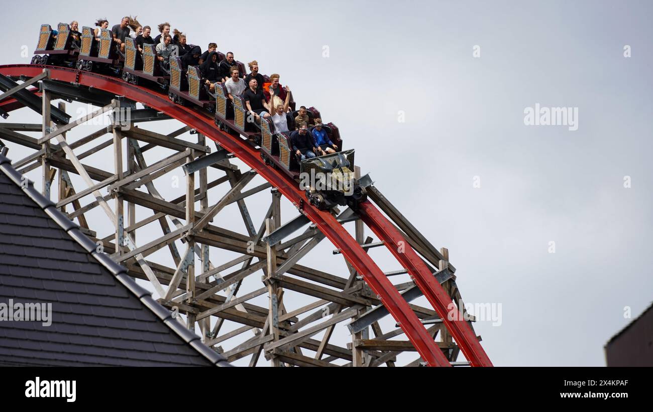 People have fun on the hybrid roller coaster "Zadra" at the amusement ...