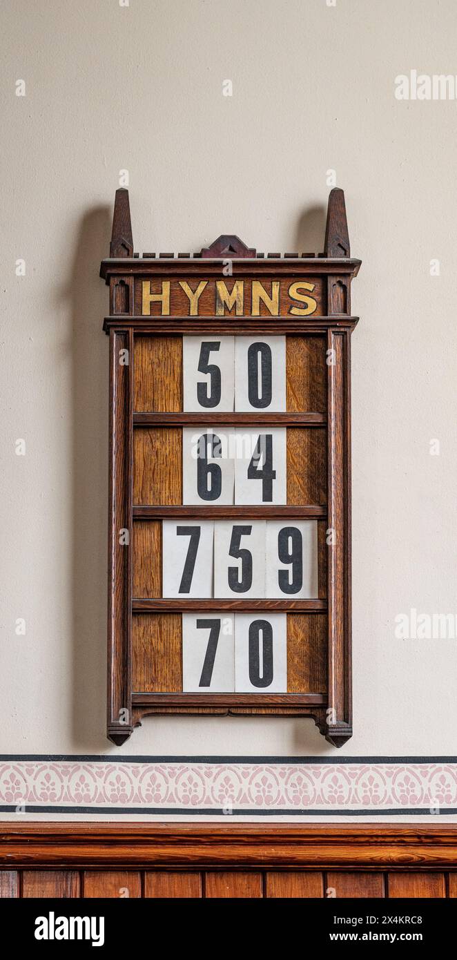 Wooden hymn board with four numbers to give order of religious songs ...