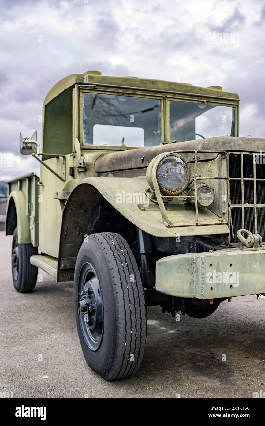 Small old vintage green rig semi-truck with round headlights and a tip ...