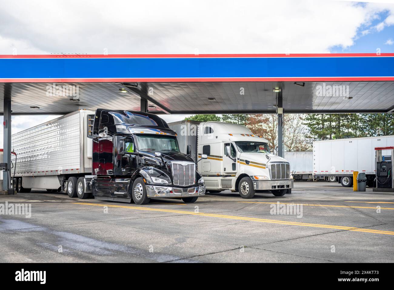 Industrial carriers different big rig semi trucks tractors with loaded ...