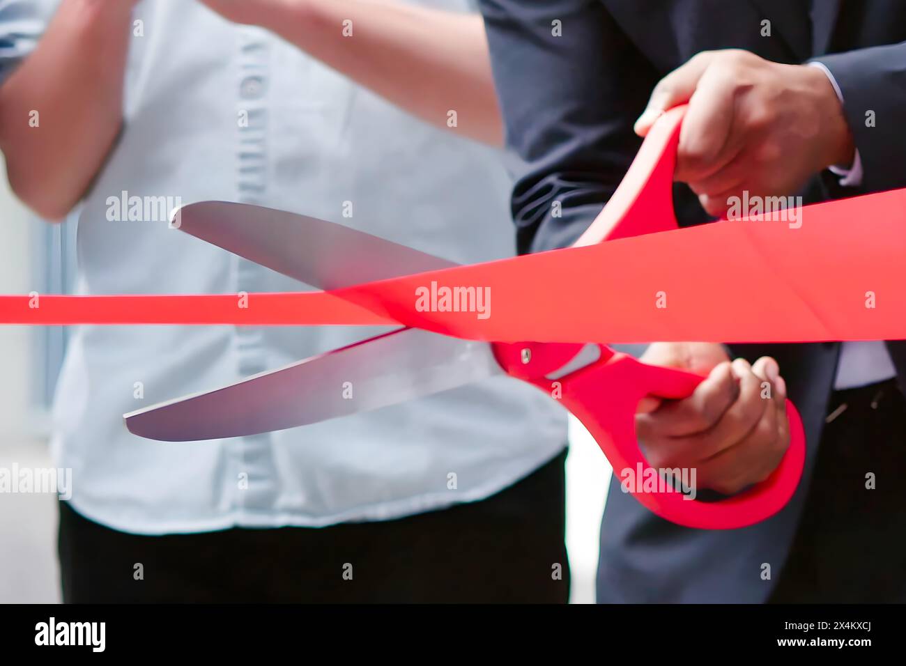 Black ribbon cutting ceremony for new outdoor business Stock Photo - Alamy