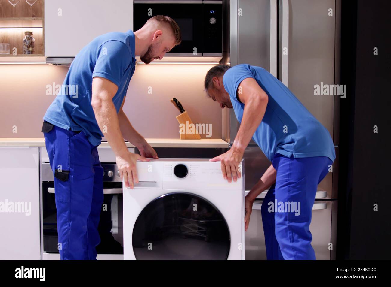 Delivery of washing machine, installation, repair and carry Stock Photo ...