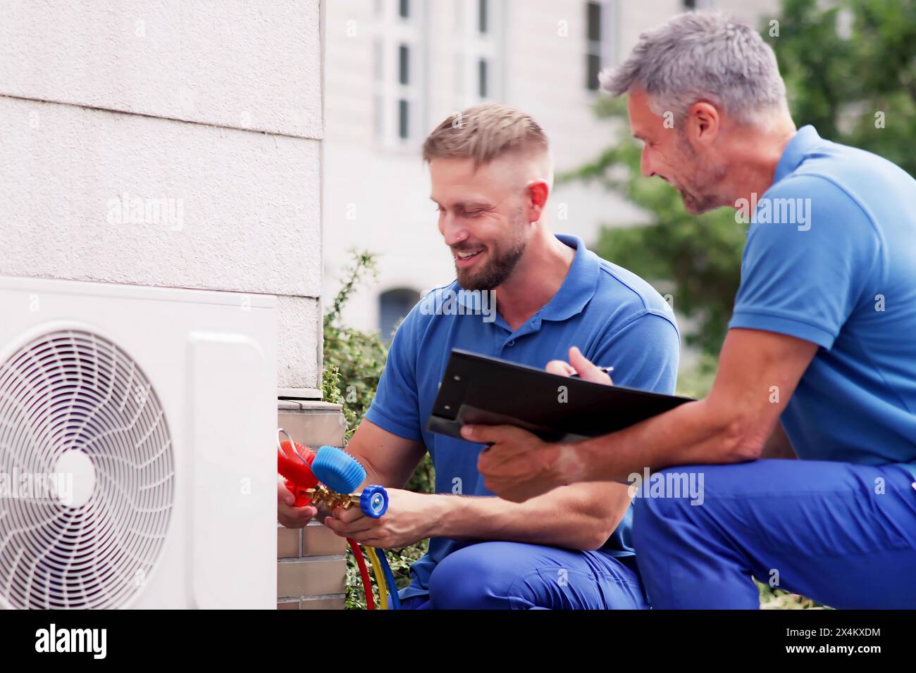 Technician Repairing Air Conditioning Unit System. HVAC Service Stock ...