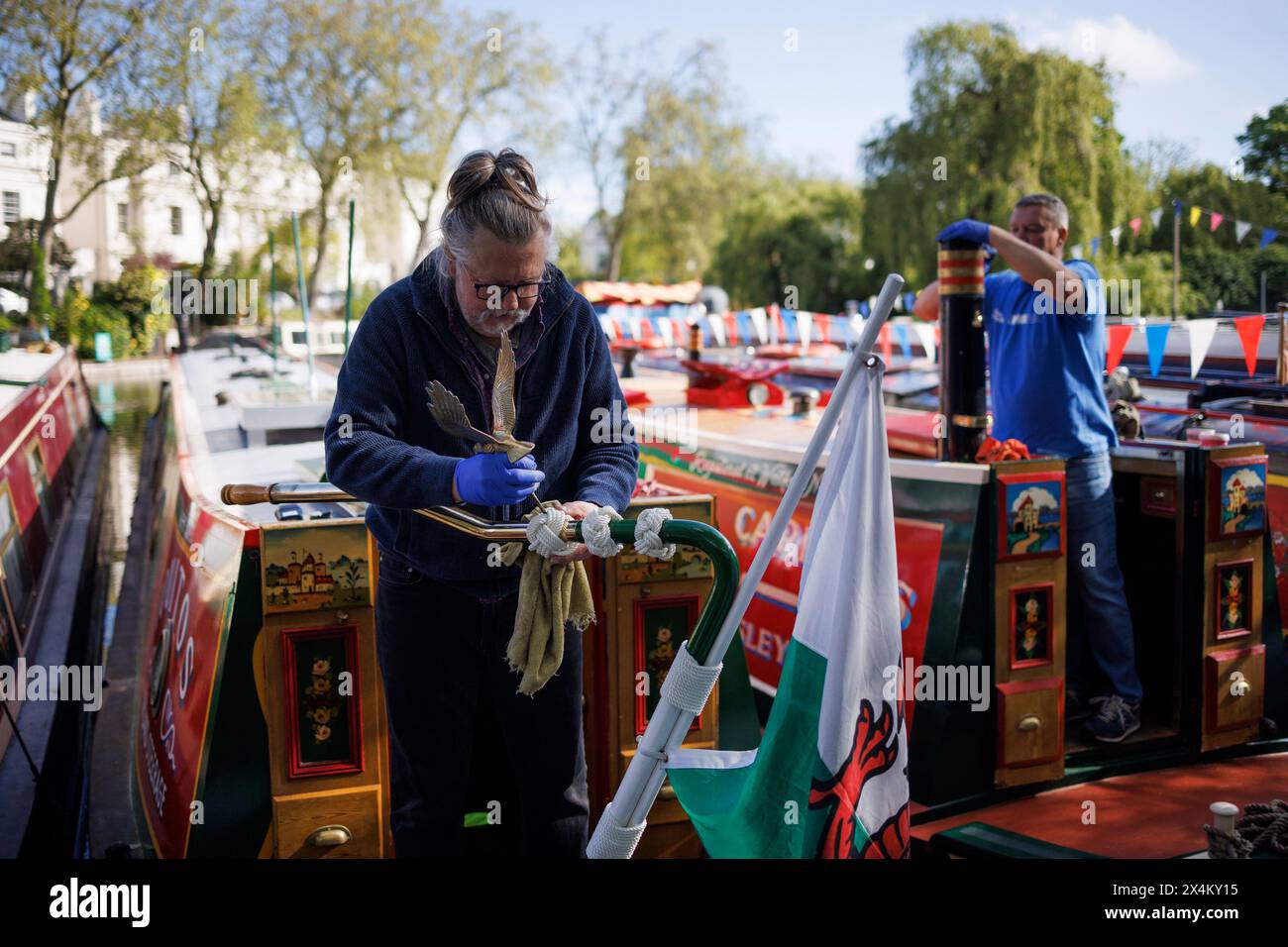 London, UK. 04th May, 2024. Narrowboat owners polish brass on their ...