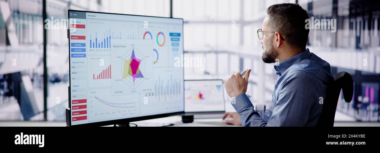 Looking at data on computer dashboard for analytic KPI in business ...