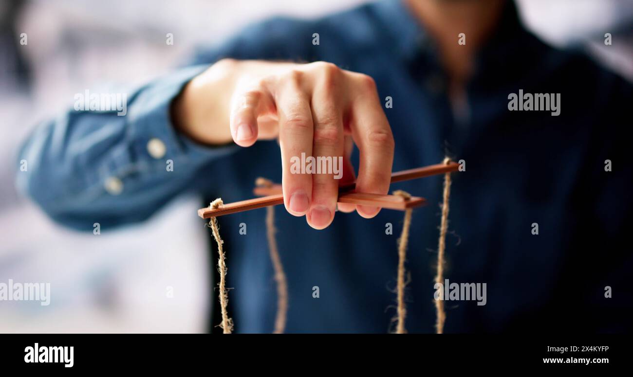 Marionette Manipulation With Hand Holding Puppet Strings Stock Photo ...
