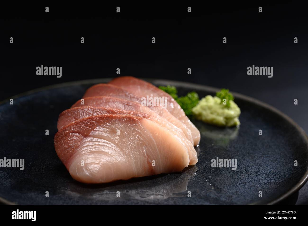 Shime Saba or raw mackerel salted and marinated in vinegar on black ...