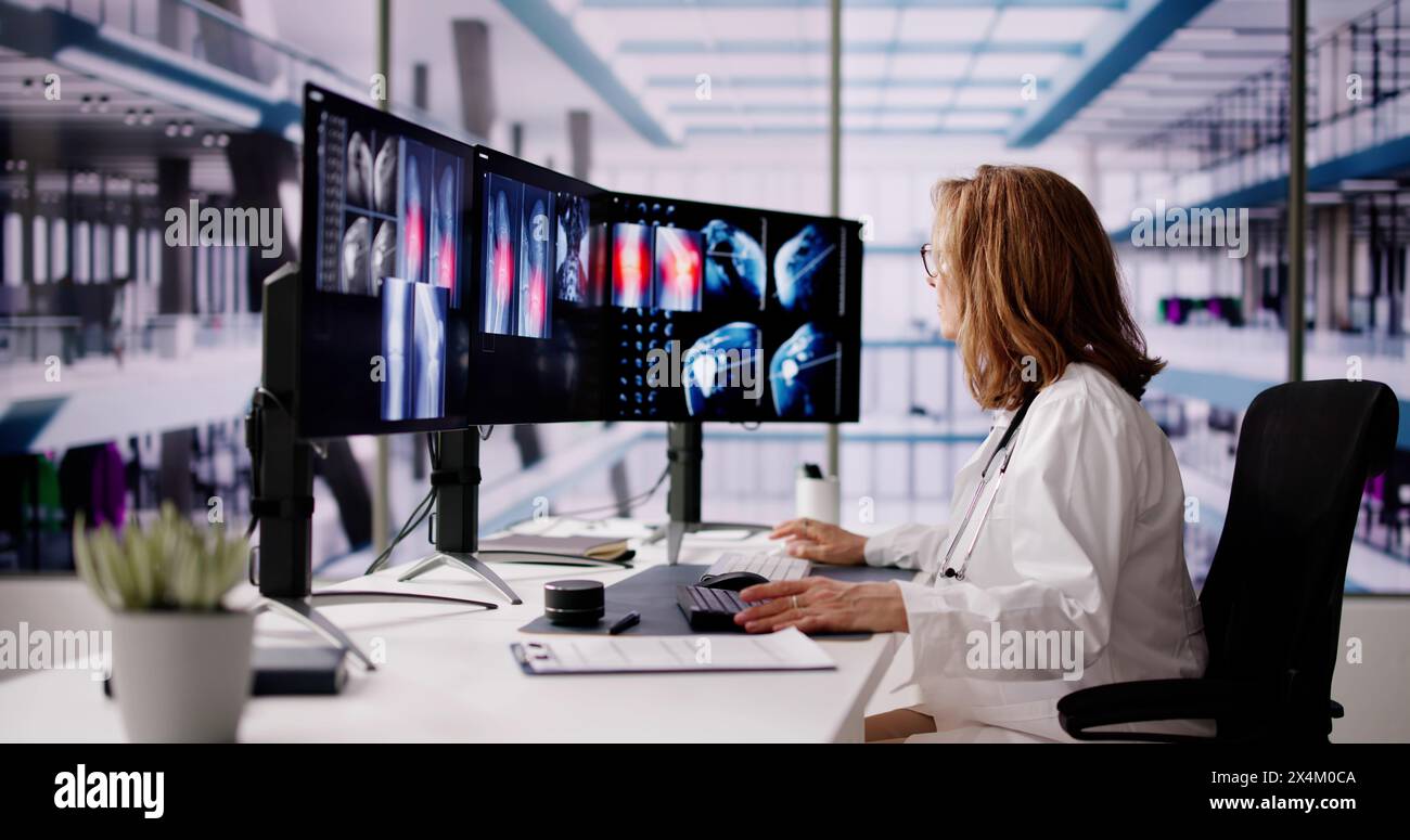Radiologist Dentist Using X Ray Software On Desktop Computer Stock ...