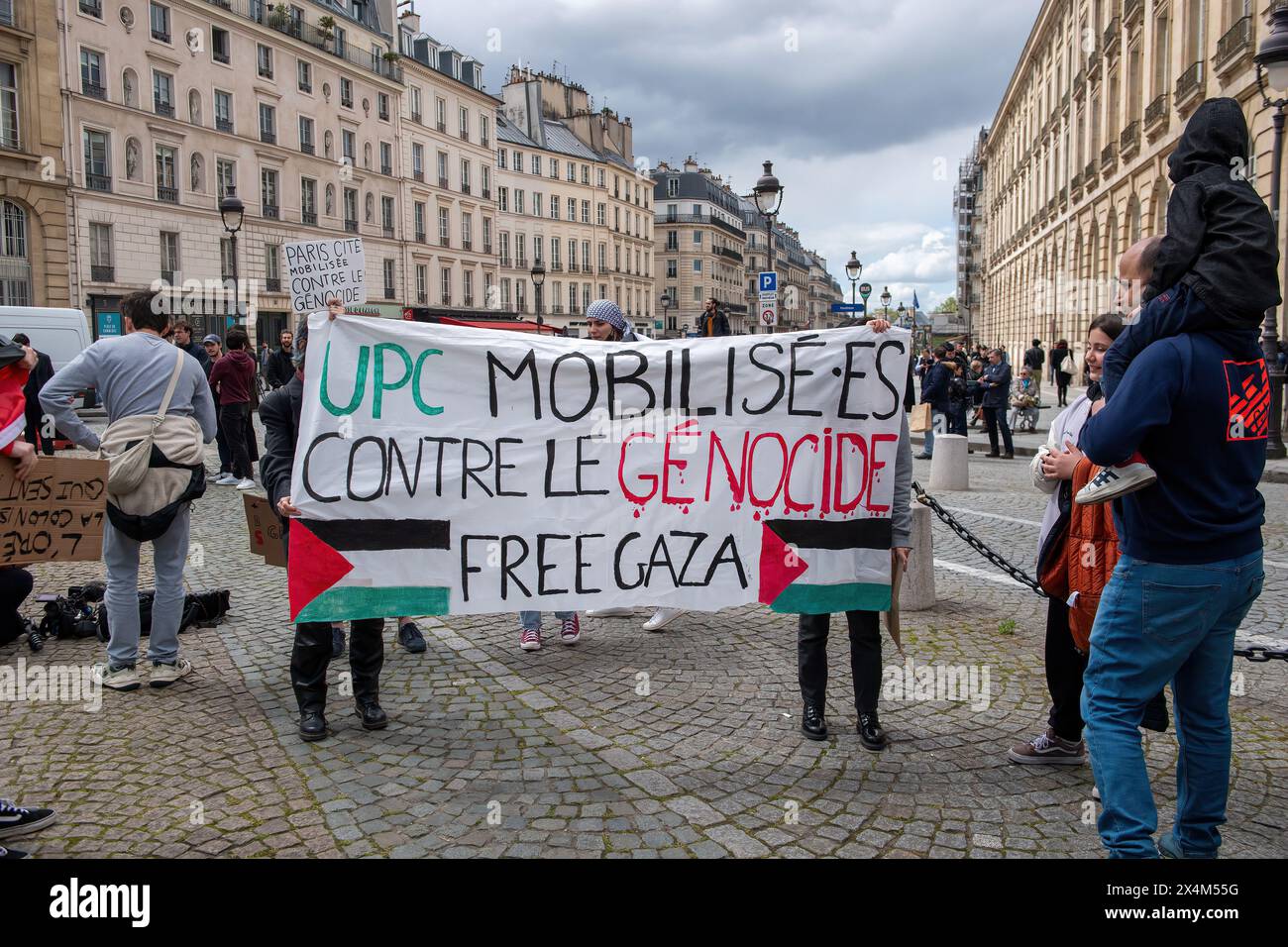 Students hold a banner during a Pro-Palestine protest led by high ...