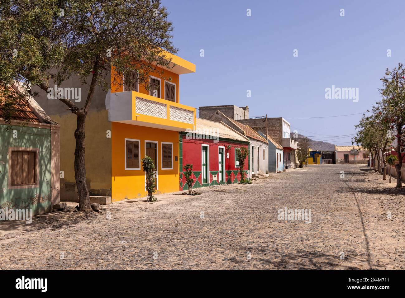 Colourful traditional houses on a street in the village of Fundo de ...
