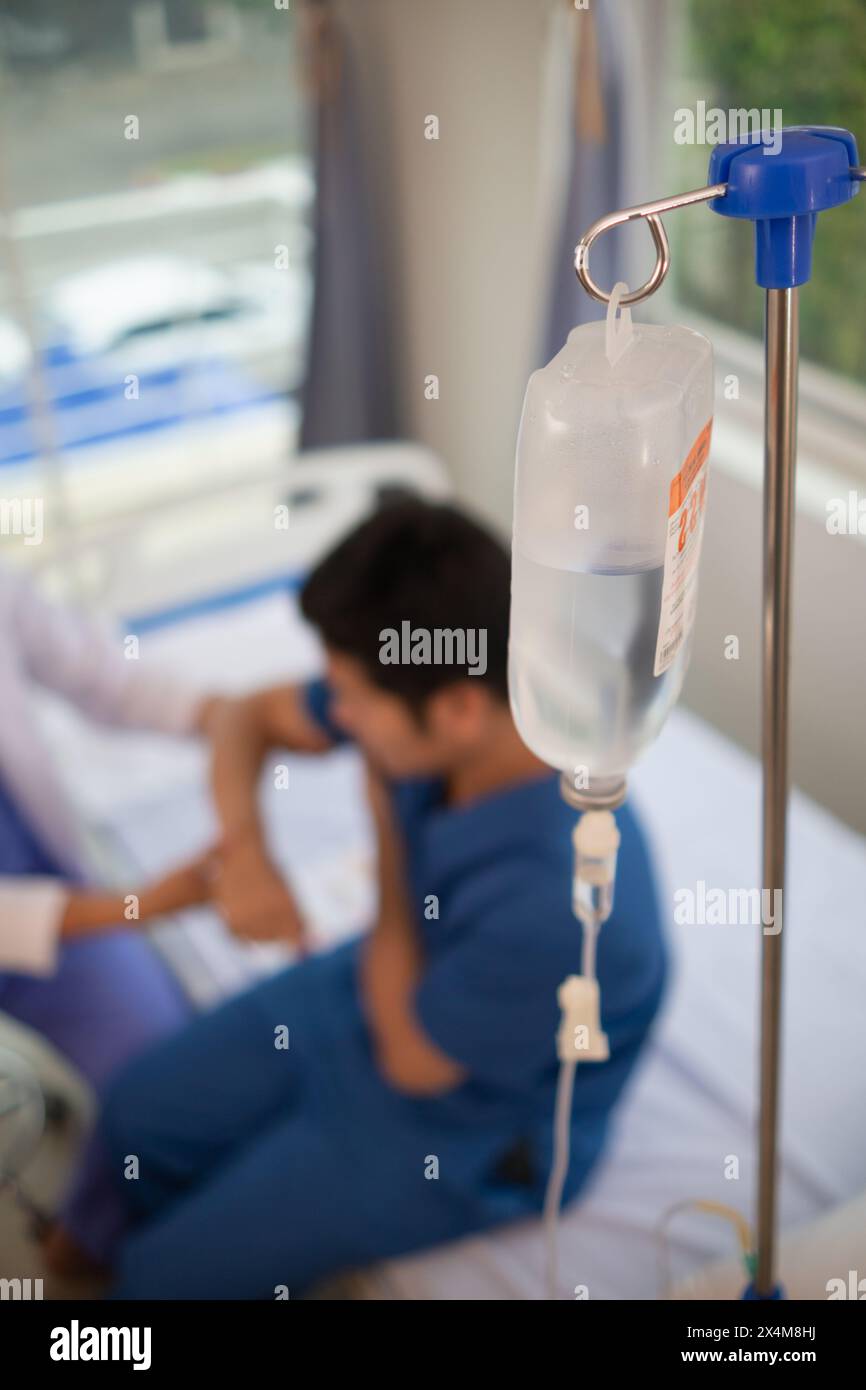An iron stand to hang saline bottle high to deliver saline via catheter ...